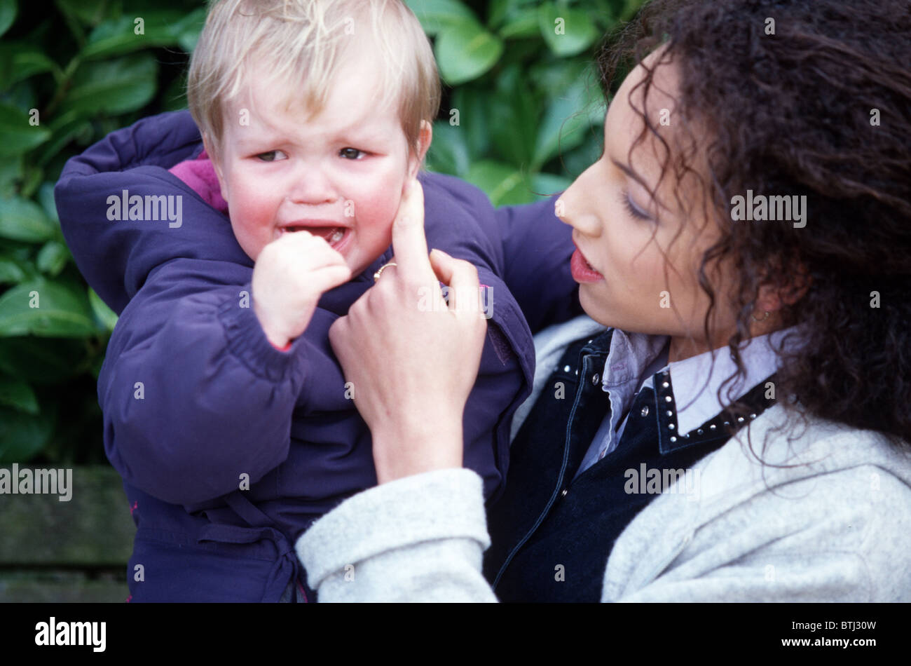 Mother stressed child scared child Stock Photo - Alamy