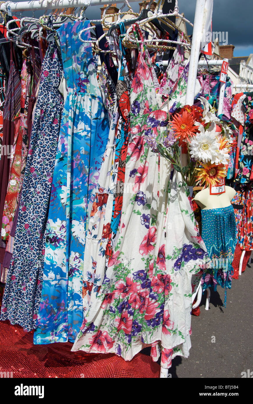 Market stall selling dresses, England Stock Photo - Alamy