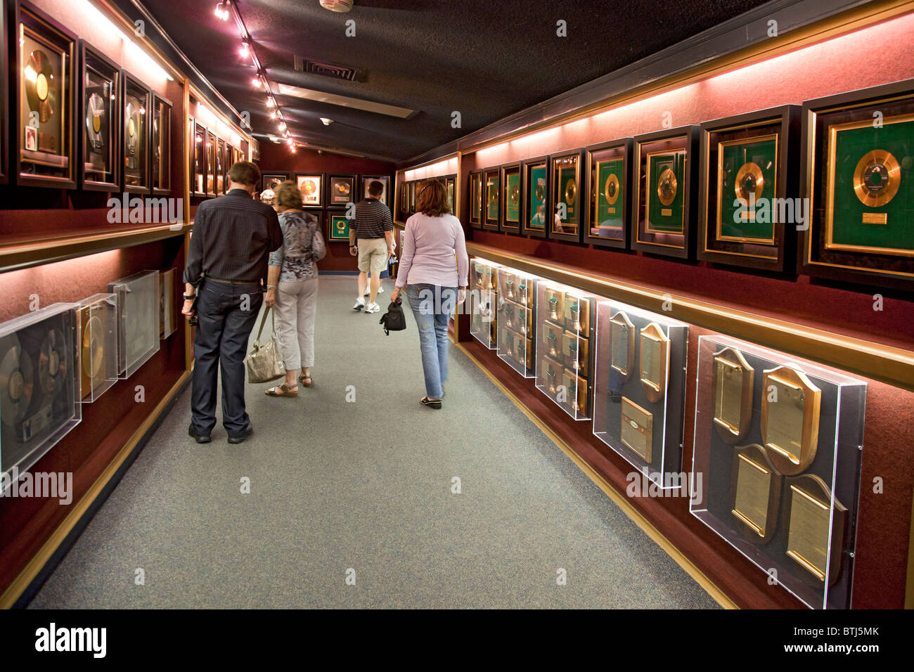 Visitors to the Hall of Gold in the Trophy Building in Graceland ...