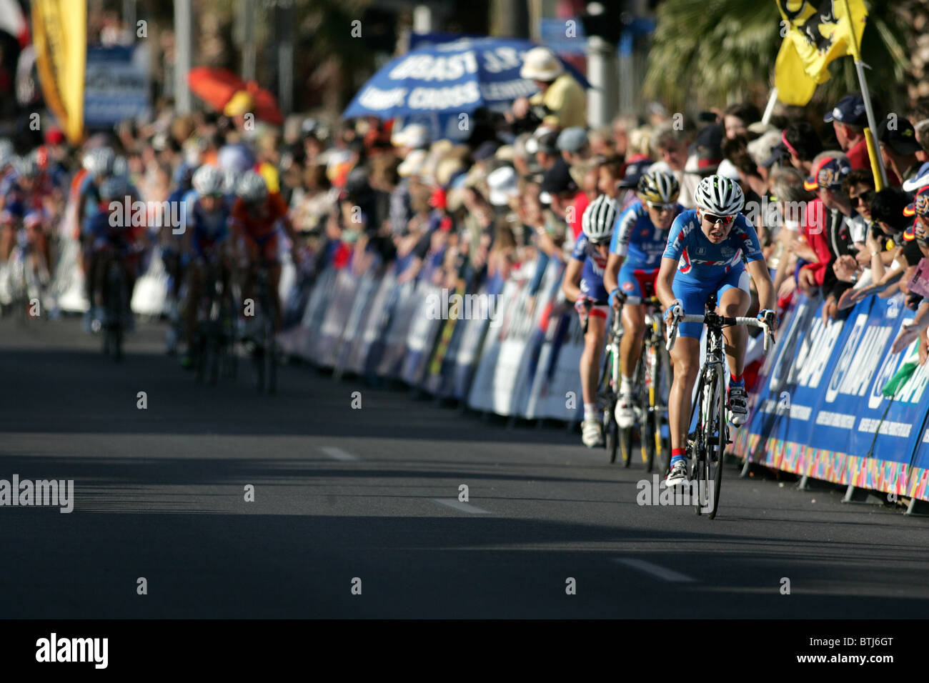 A Russian rider leads the chase group rides up the hill past the start ...