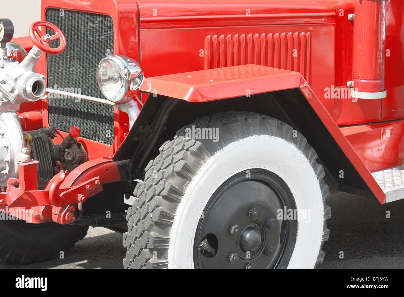 Red vintage fire truck (fire-engine) closeup Stock Photo - Alamy