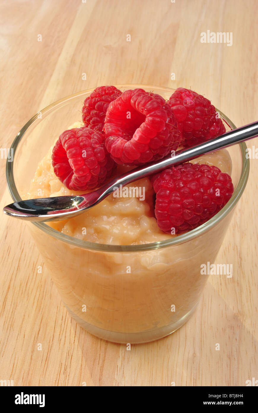 home made creamed rice pudding with raspberries Stock Photo - Alamy