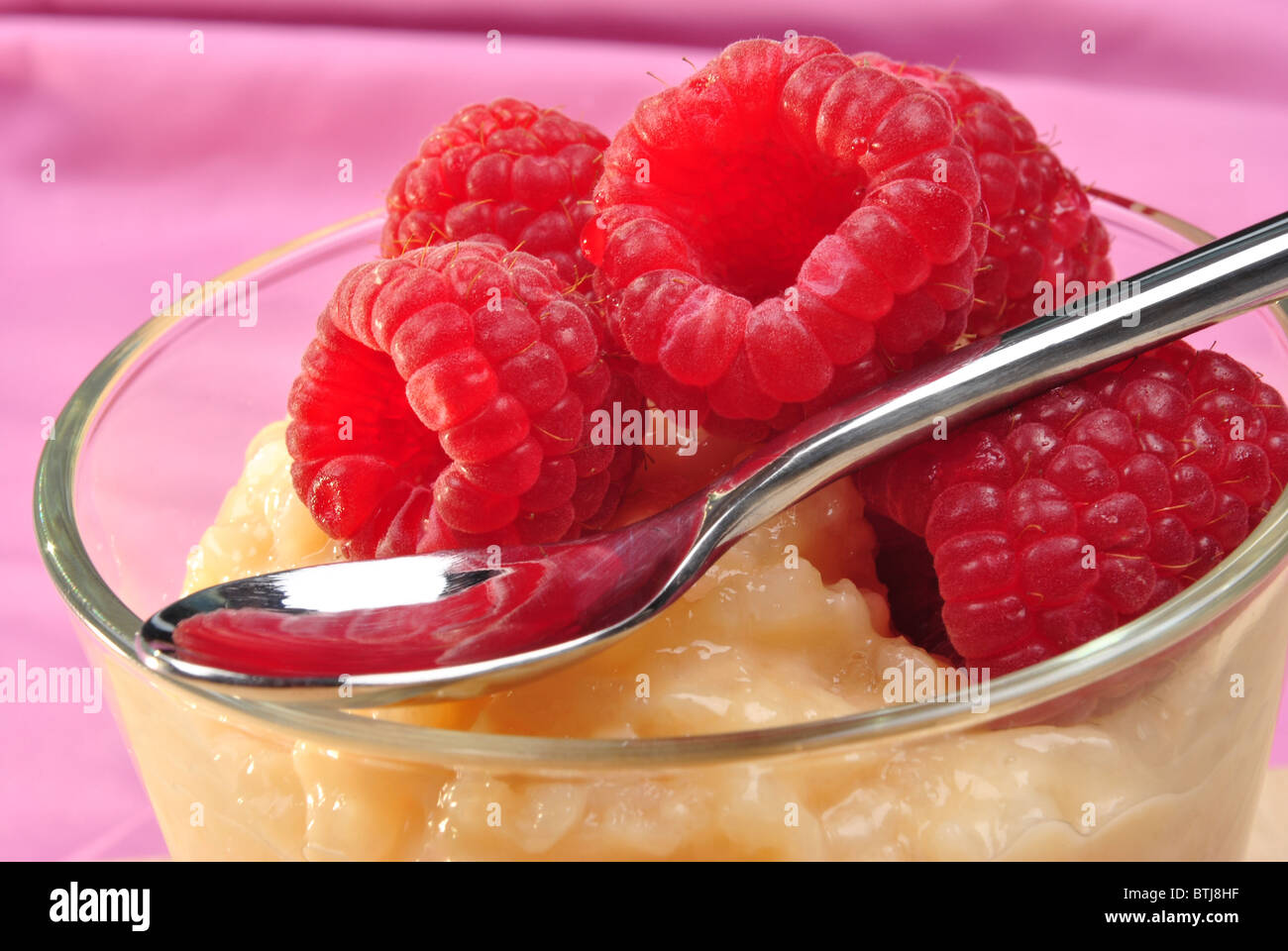 home made creamed rice pudding with raspberries Stock Photo - Alamy
