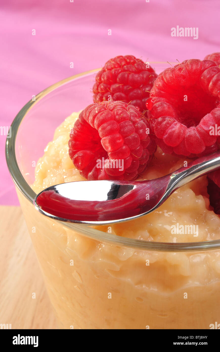 home made creamed rice pudding with raspberries Stock Photo - Alamy