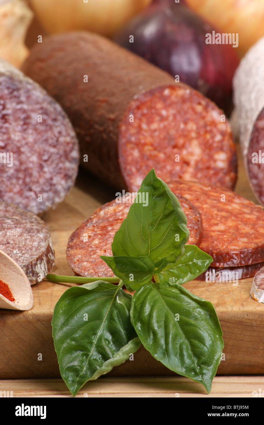 salami and some slices salami on a timber board Stock Photo - Alamy