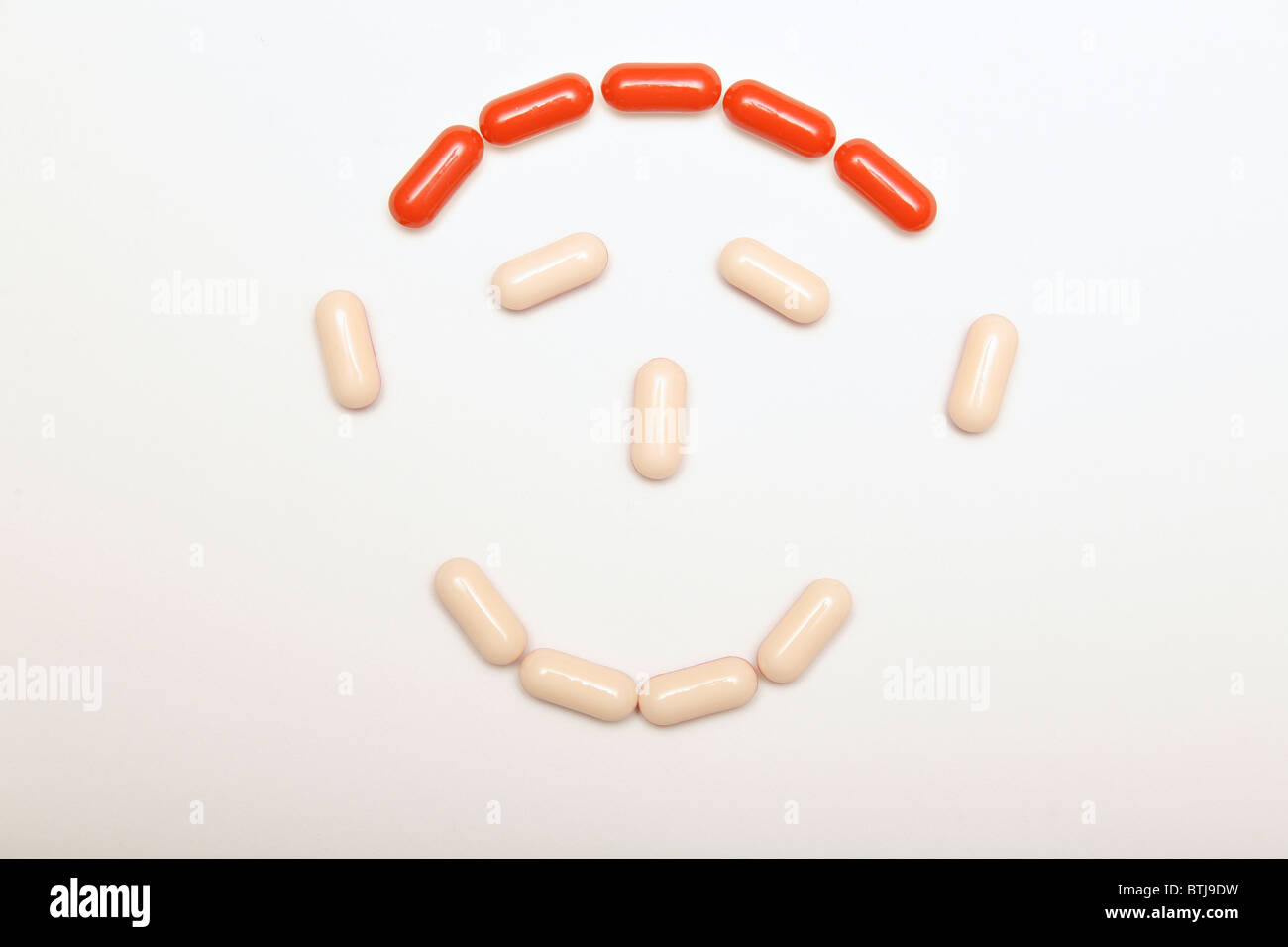 medication and pills face on gray background Stock Photo - Alamy