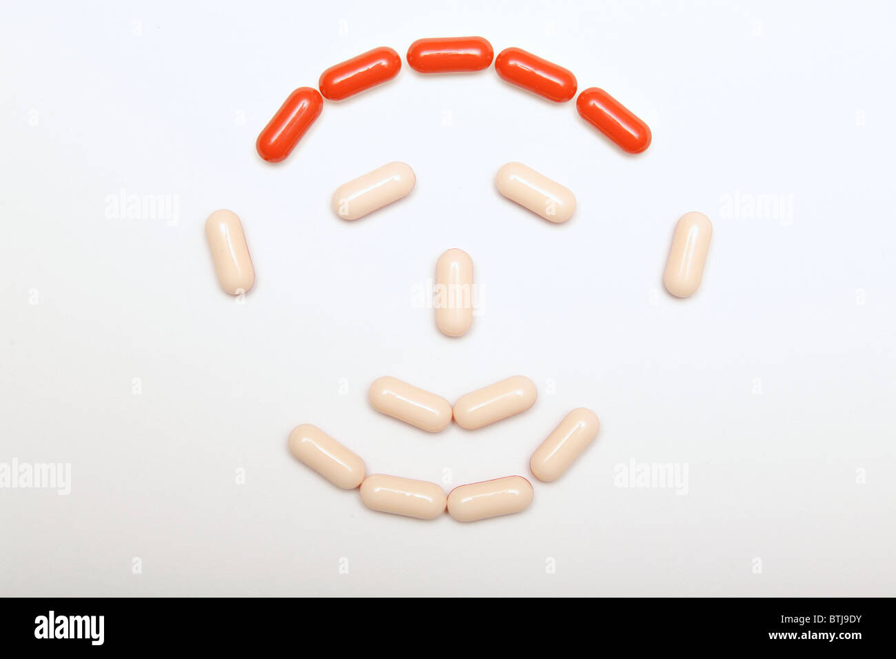 medication and pills face on gray background Stock Photo - Alamy