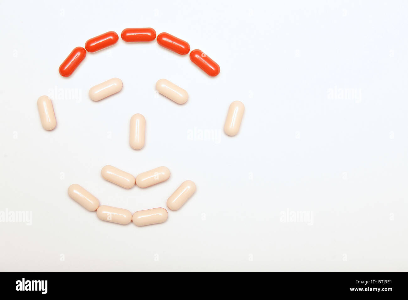 medication and pills face on gray background Stock Photo - Alamy