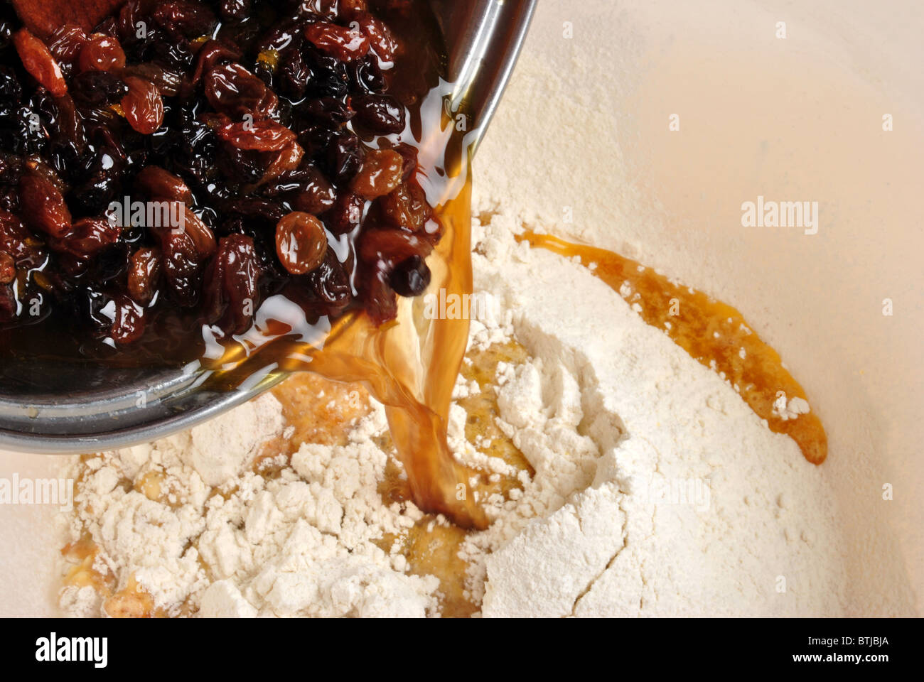 mix ingredients to make a home made fruit cake Stock Photo - Alamy