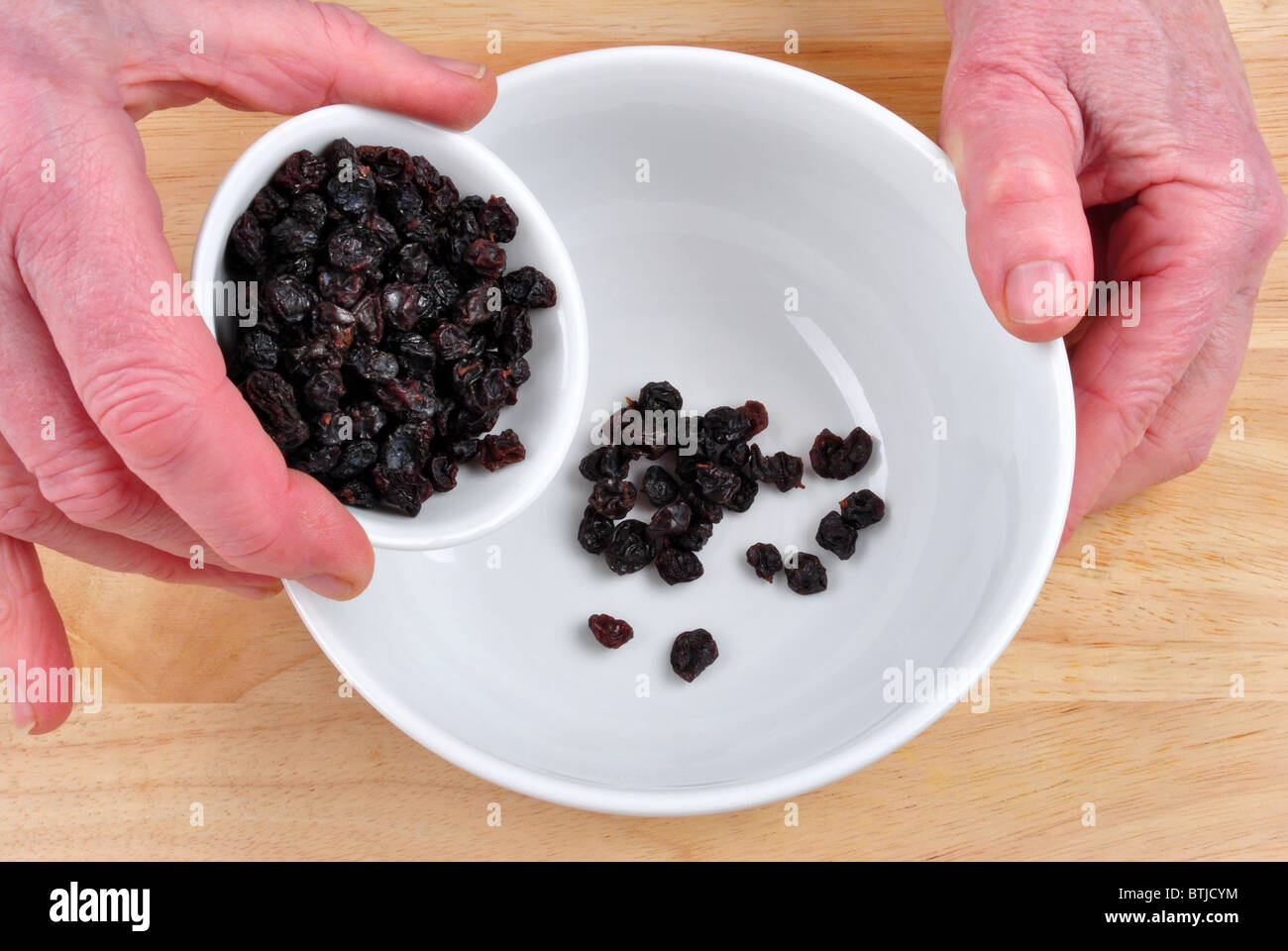 prepare some sweet raisins for home baking Stock Photo - Alamy