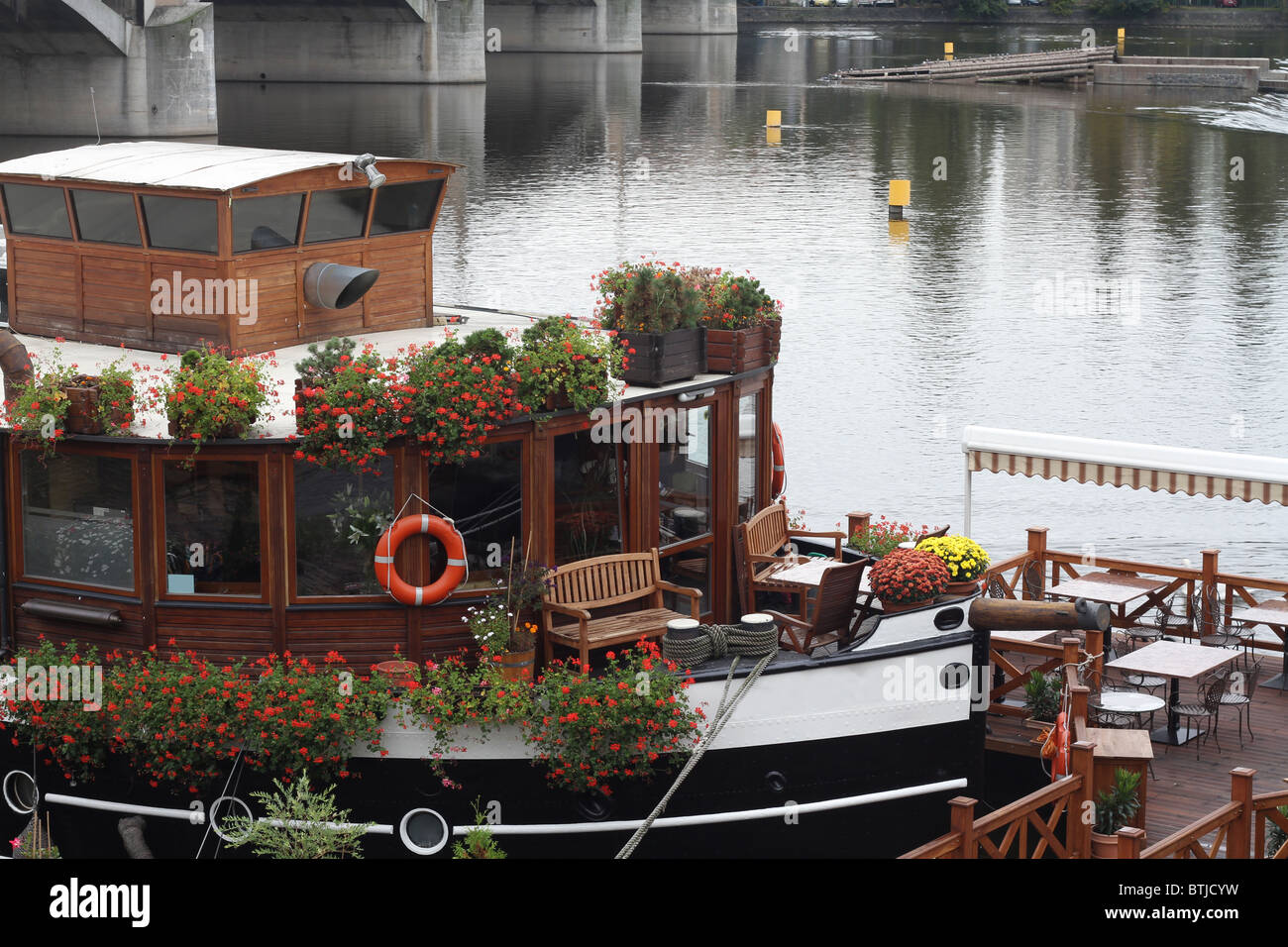 Beautiful Boat on the river with flowers Stock Photo - Alamy
