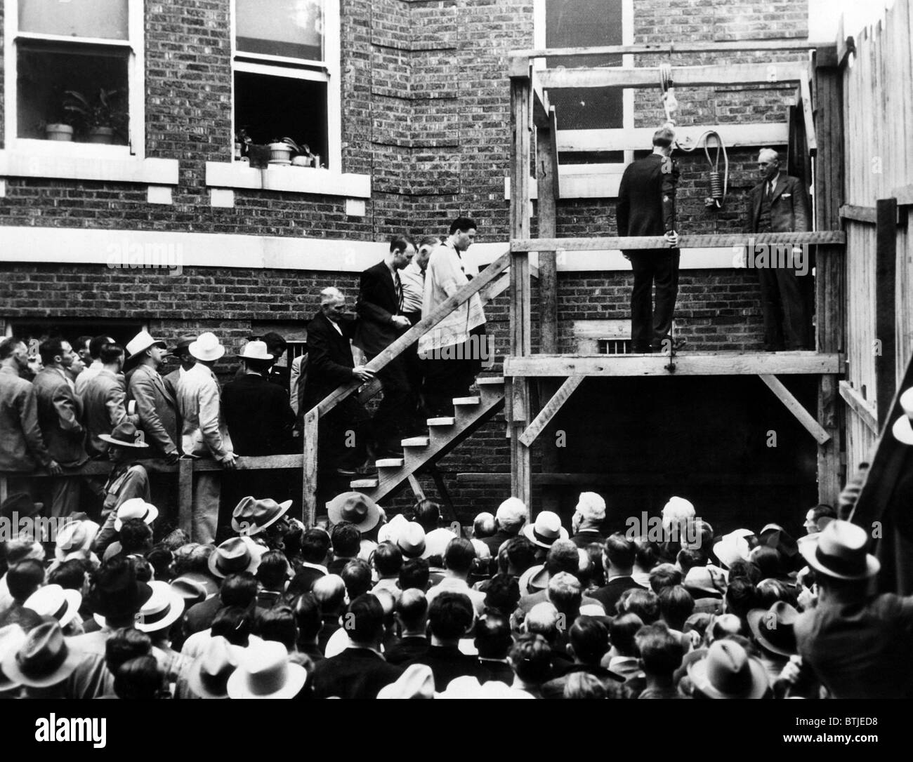 Roscoe 'Red' Jackson (behind priest) walks up the steps before he is ...