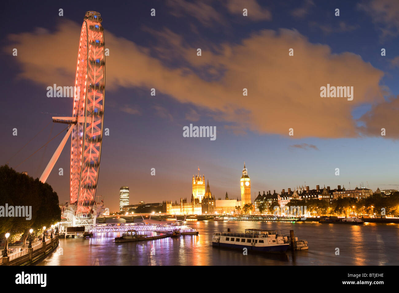 The London Eye and Houses of Parliament on the Thames embankment ...