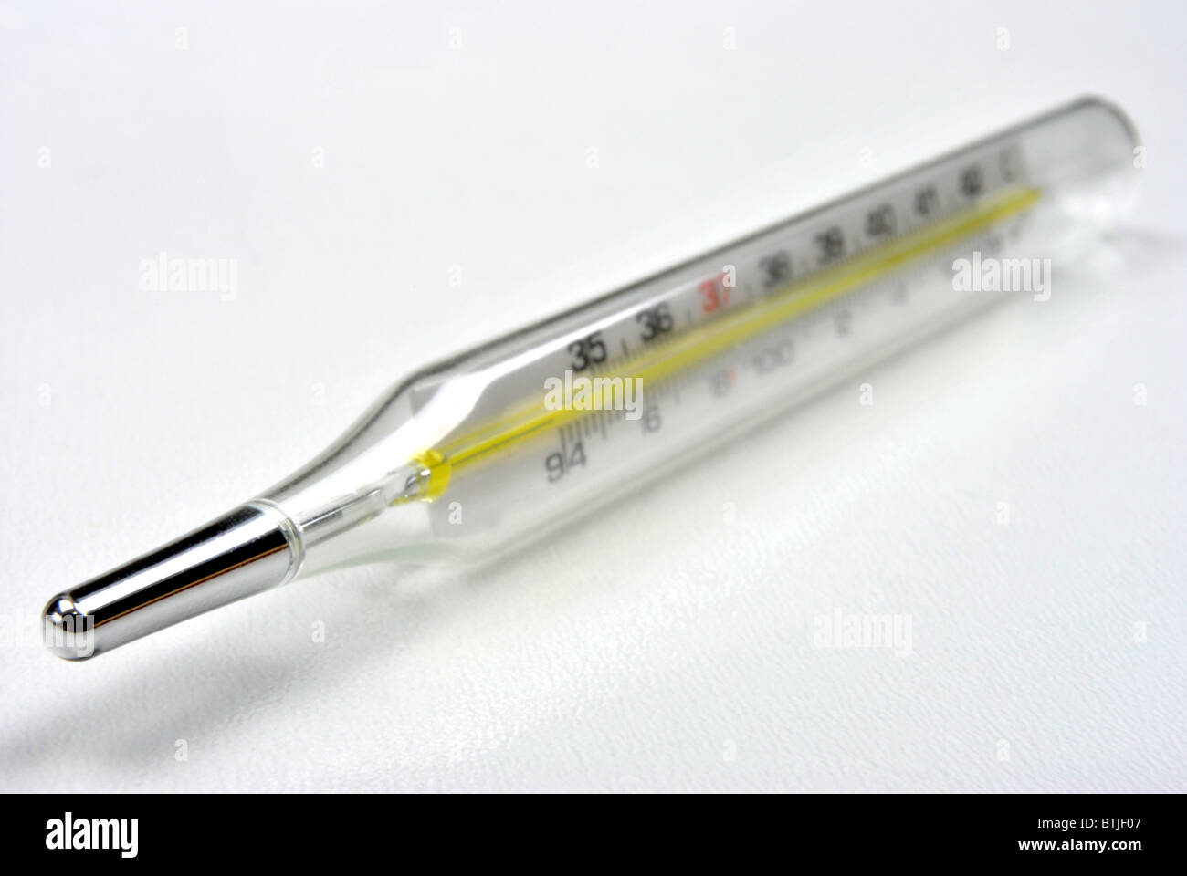 analogue clinical thermometer on a white background Stock Photo - Alamy