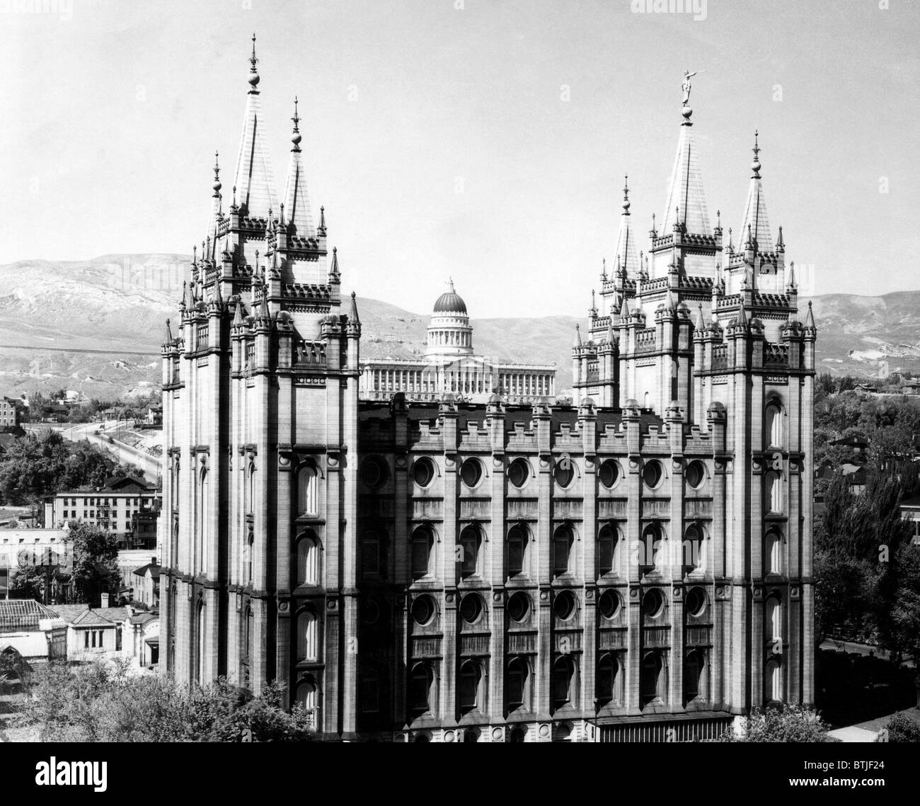 The Salt Lake City Mormon Temple with Utah's state Capitol Building in ...