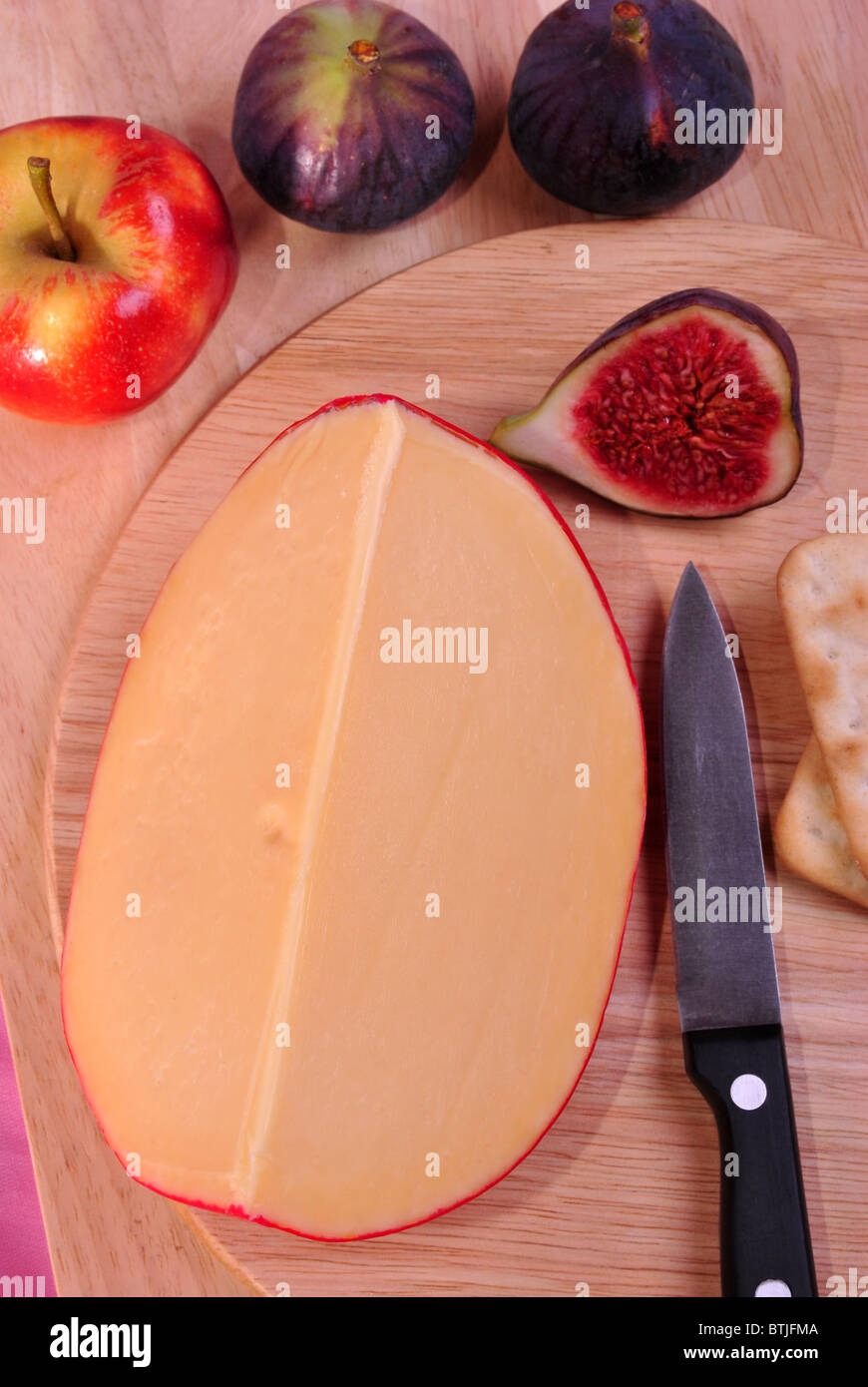 timber board with some organic gouda cheese Stock Photo - Alamy