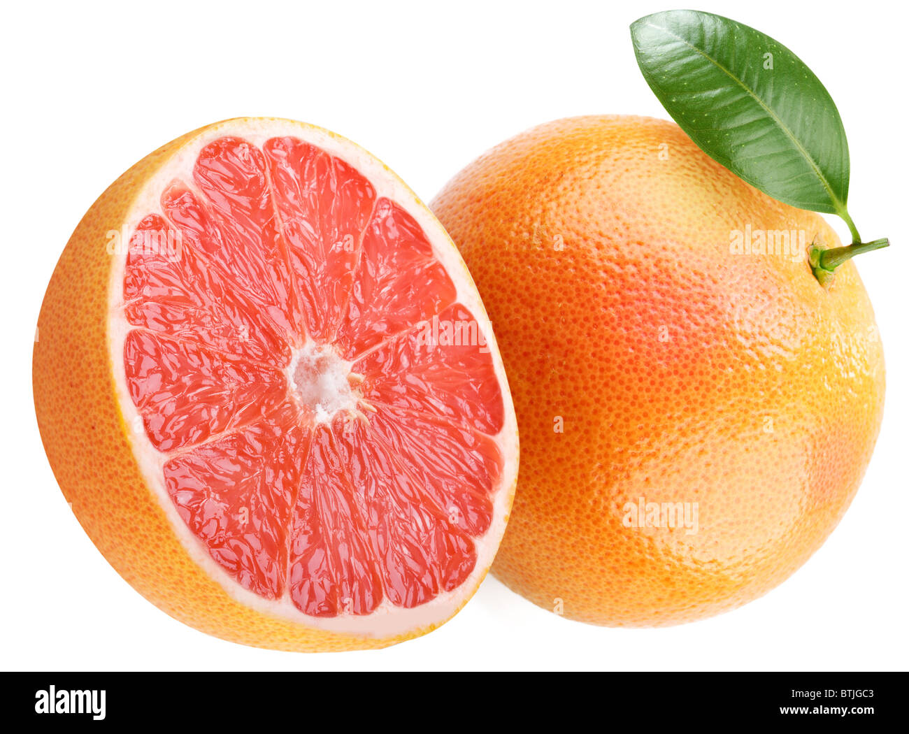 Ripe grapefruit with leaf and half of fruit. Isolated on a white Stock ...