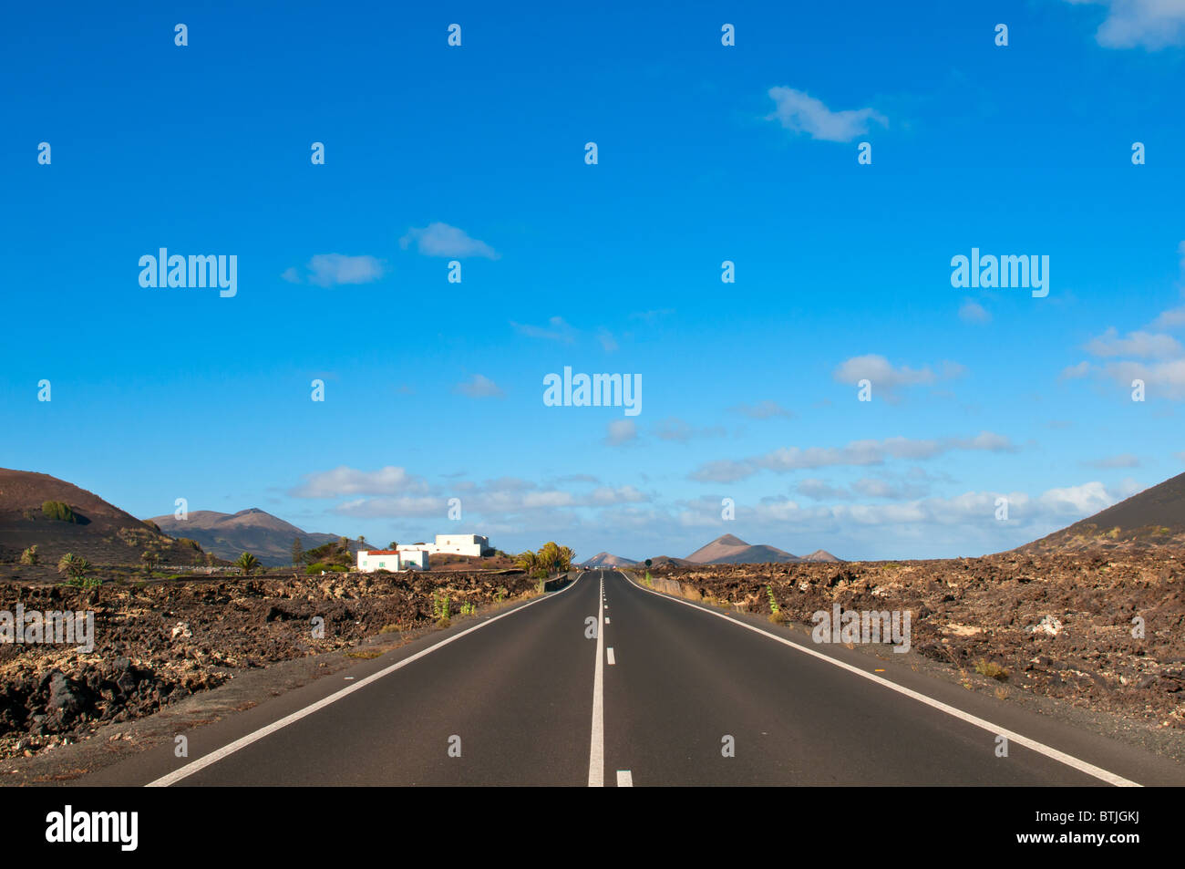 Road between rocks in the Lanzarote island Stock Photo - Alamy
