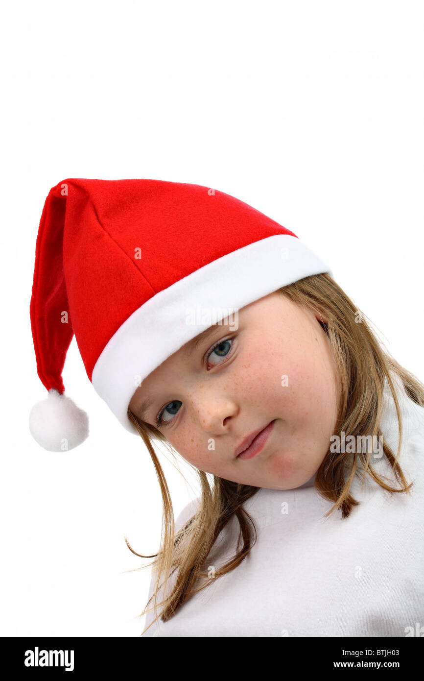 Girl with tilted head in Santa's red hat isolated on white Stock Photo ...