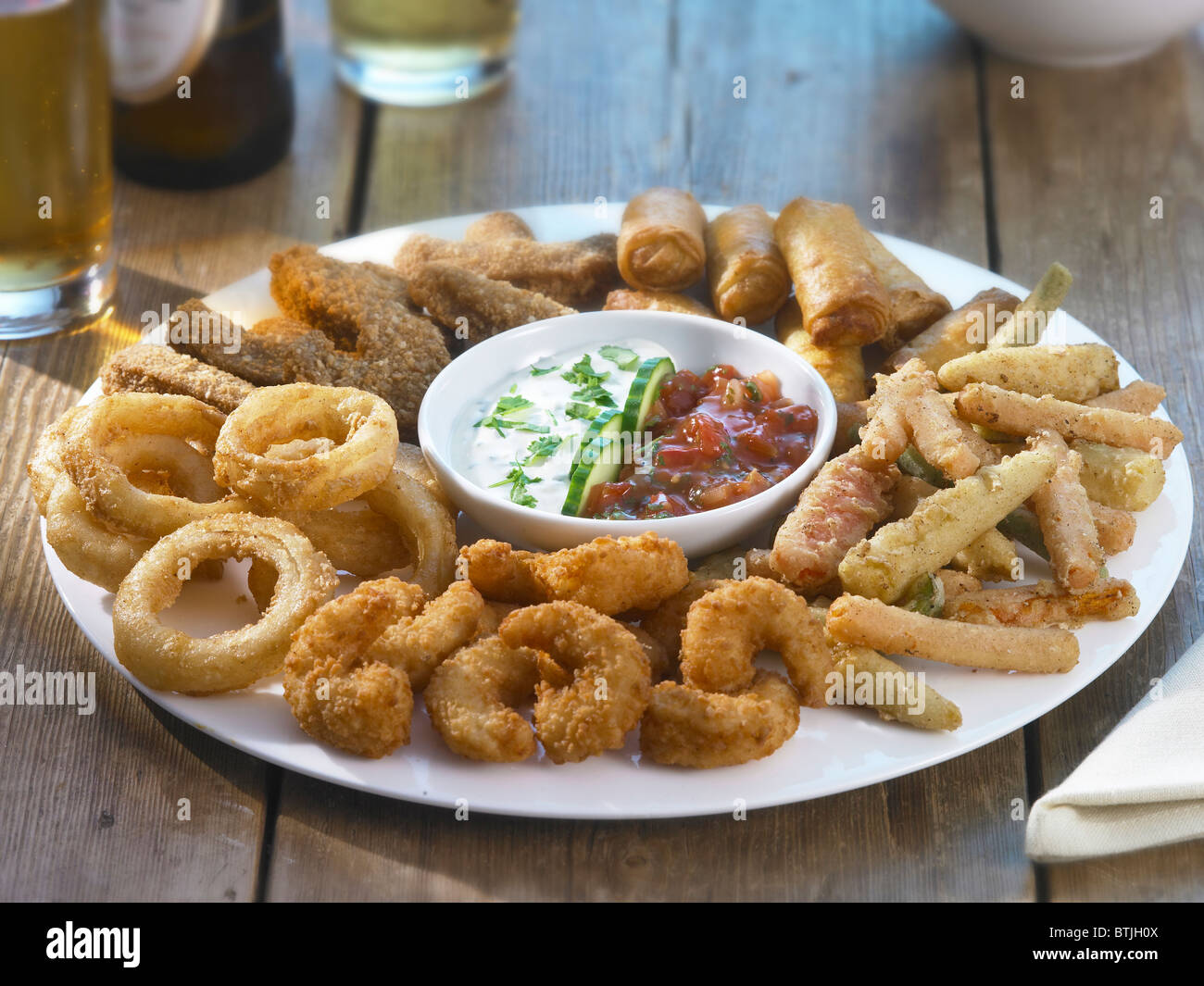 sharing plate of nibbles and dip Stock Photo - Alamy