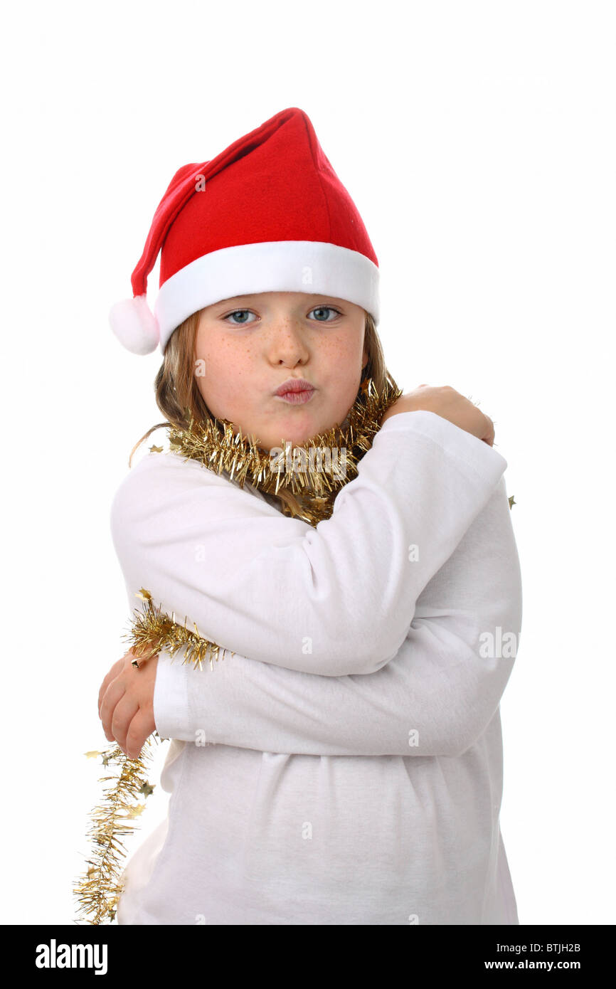 Small girl in Santa's red hat with golden chains isolated on white ...