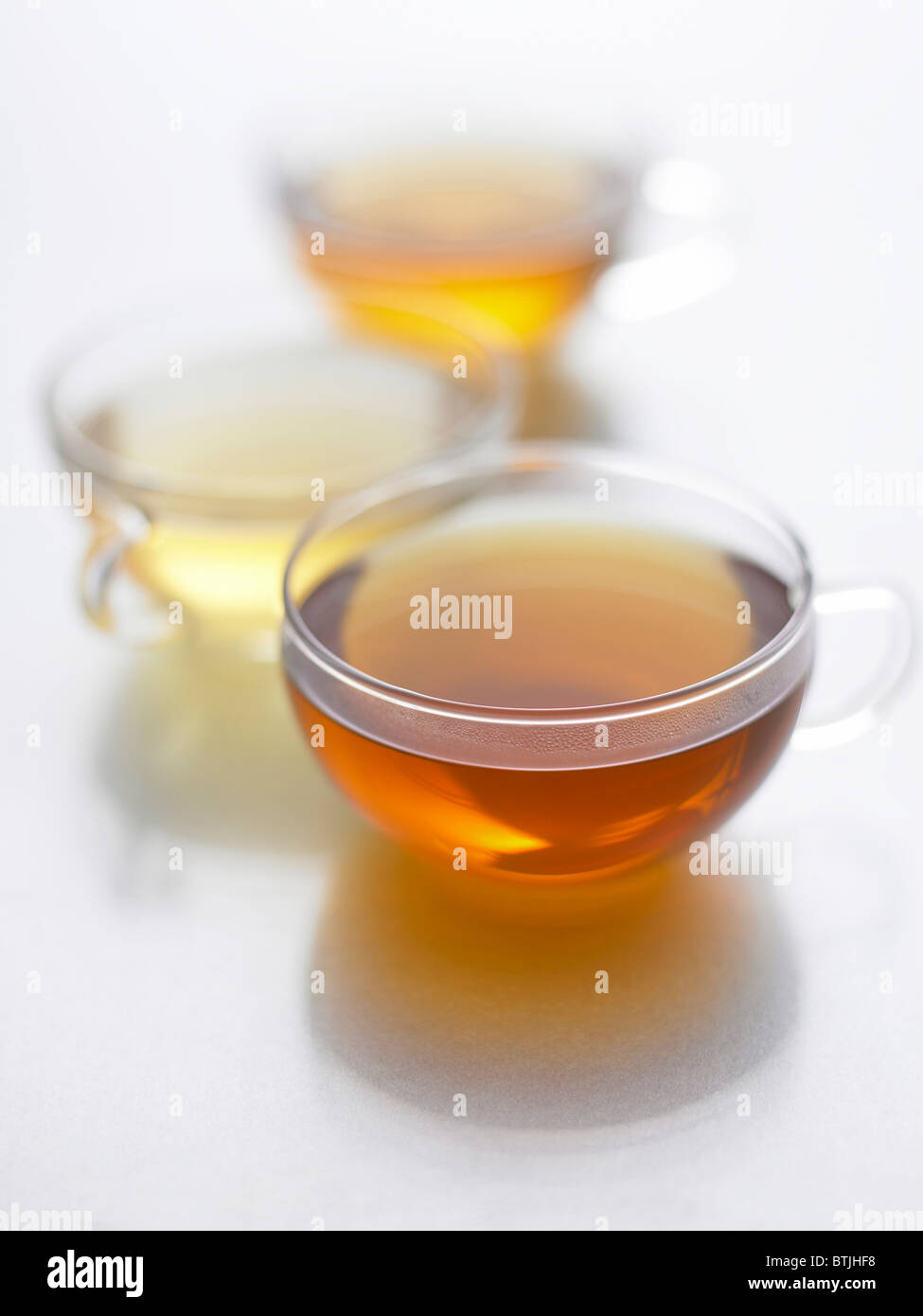 three glass cups of tea without milk Stock Photo - Alamy