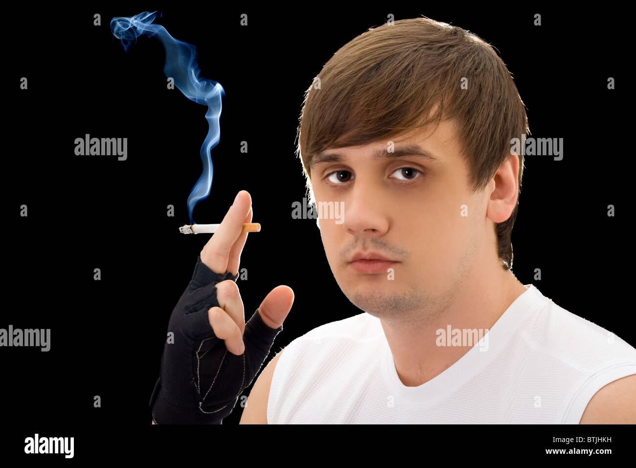 Portrait of the young man with a cigarette. Isolated Stock Photo - Alamy