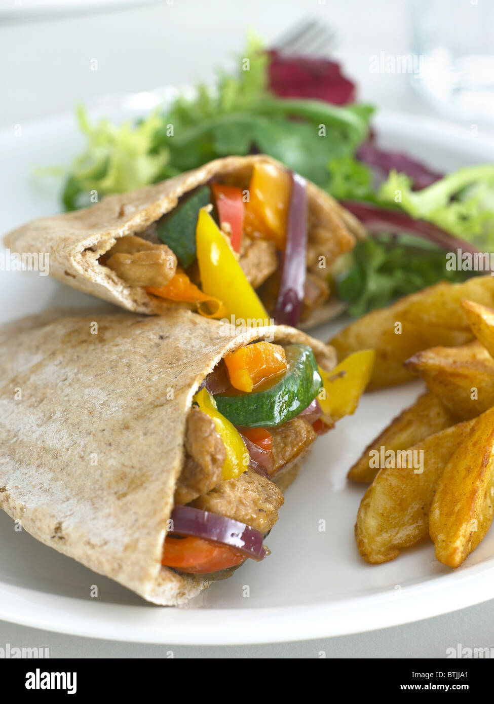 chicken and vegetable filled pitta bread Stock Photo - Alamy