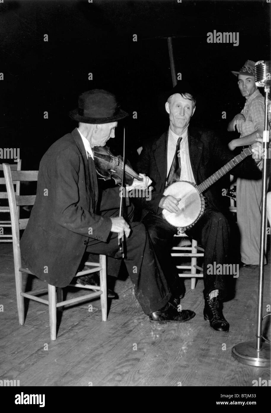 R. J. Boyd, playing fiddle, and Millard Garrett, playing banjo, both ...