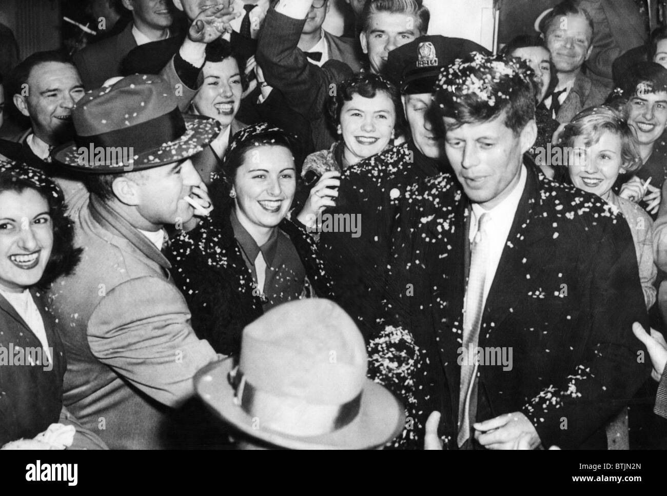 John F. Kennedy (right, facing camera), arrives at his Boston campaign ...