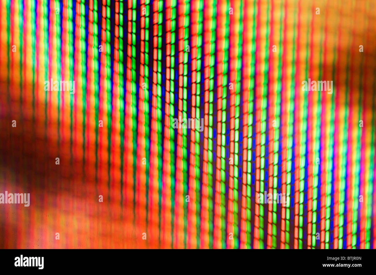 A micro photo of the face of a traditional television set. The red blue ...