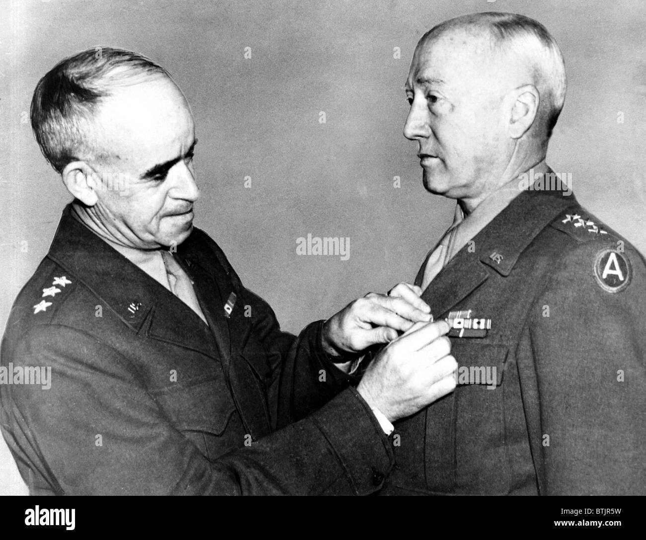 General Omar N. Bradley pins Bronze Cluster on the lapel of Lt. General ...