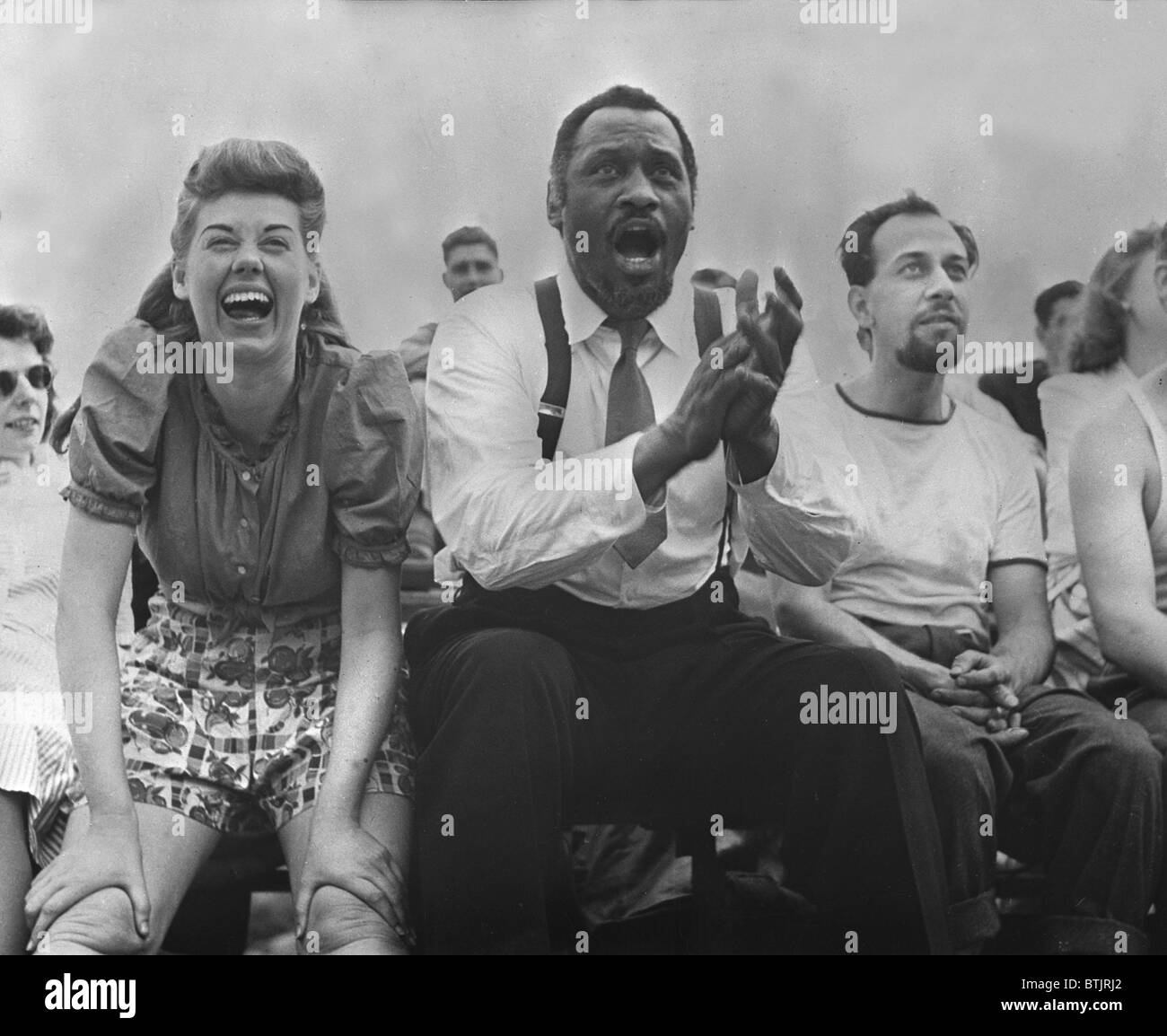 New York City, Paul Robeson (center), Jose Ferrer (right), watching ...