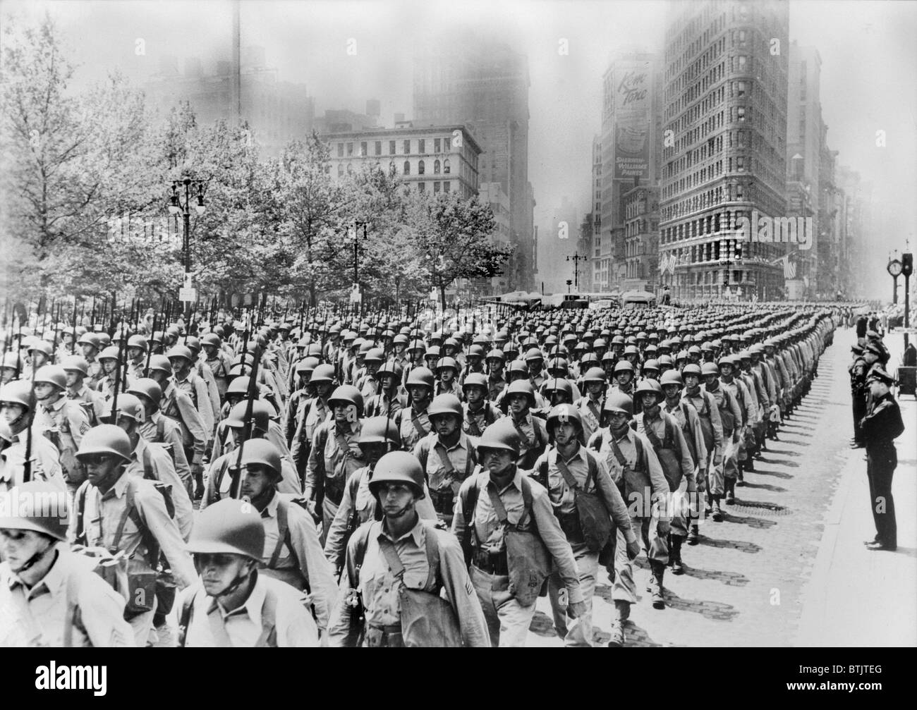 World War II, massed infantry units march up Fifth Avenue, New York ...