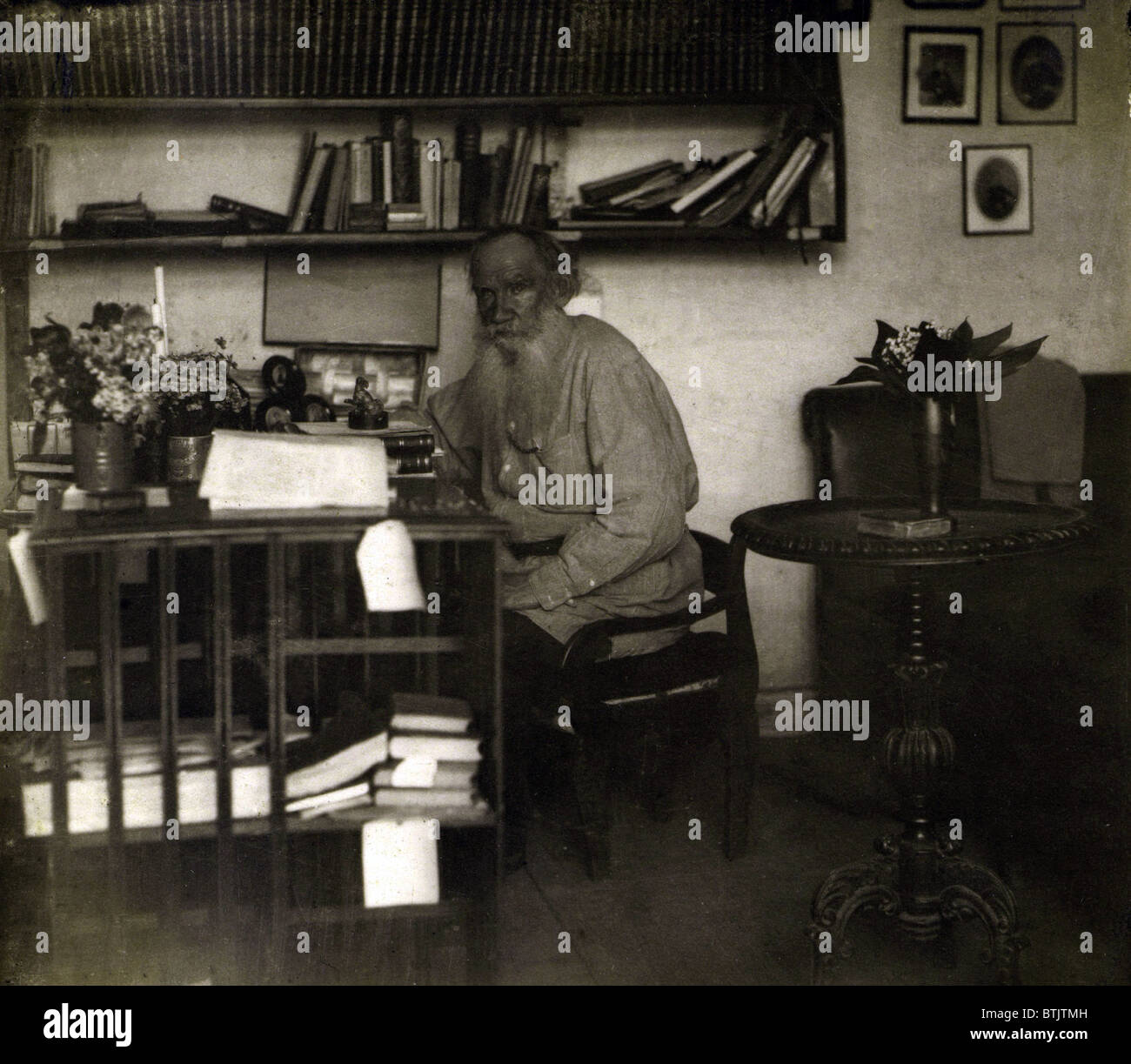 Leo Tolstoy (1828-1910) Russian novelist, writing in his study at the ...