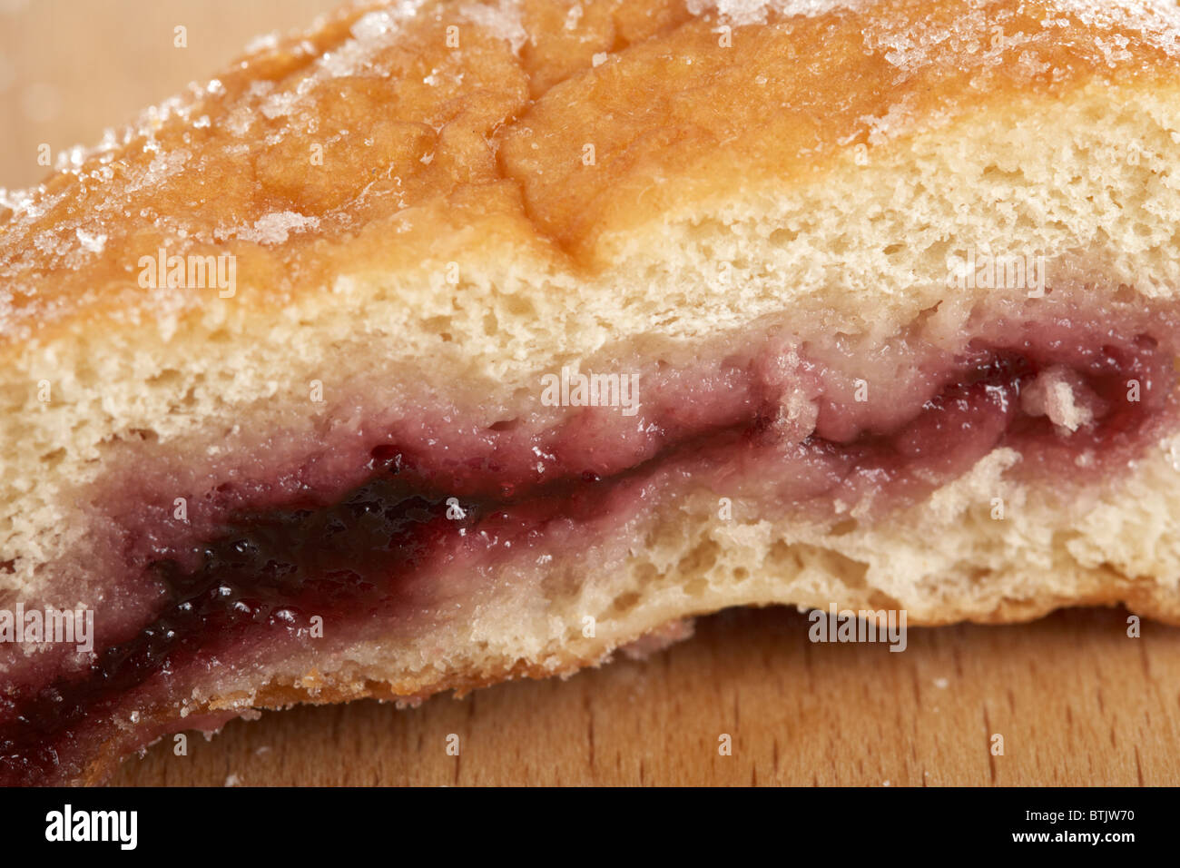 cut sliced jam filled doughnut Stock Photo - Alamy