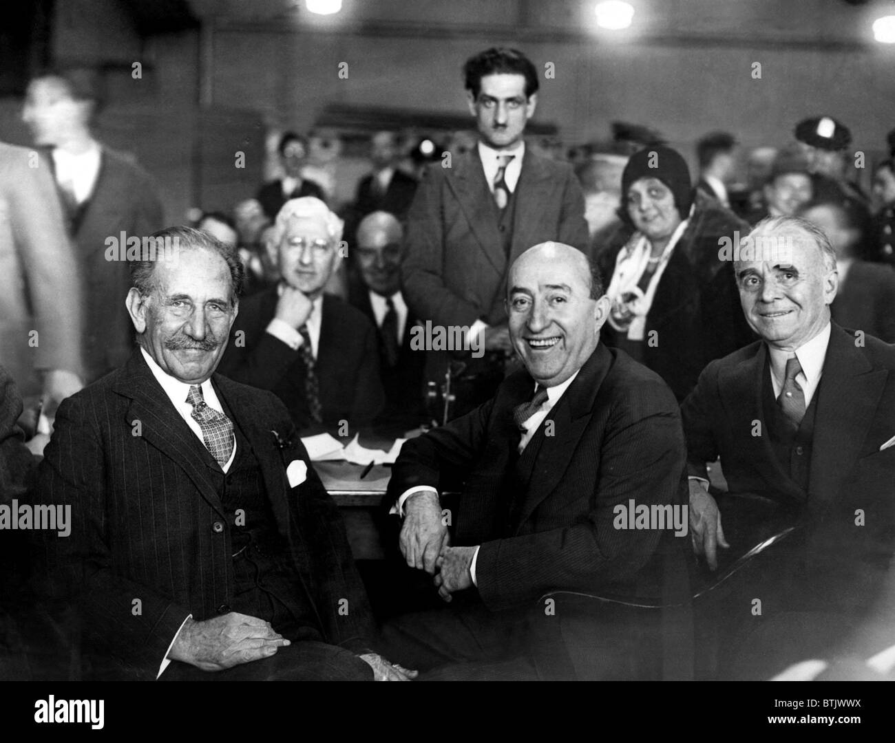 William Fox (center right), founder of the Fox Film Corporation, and ...