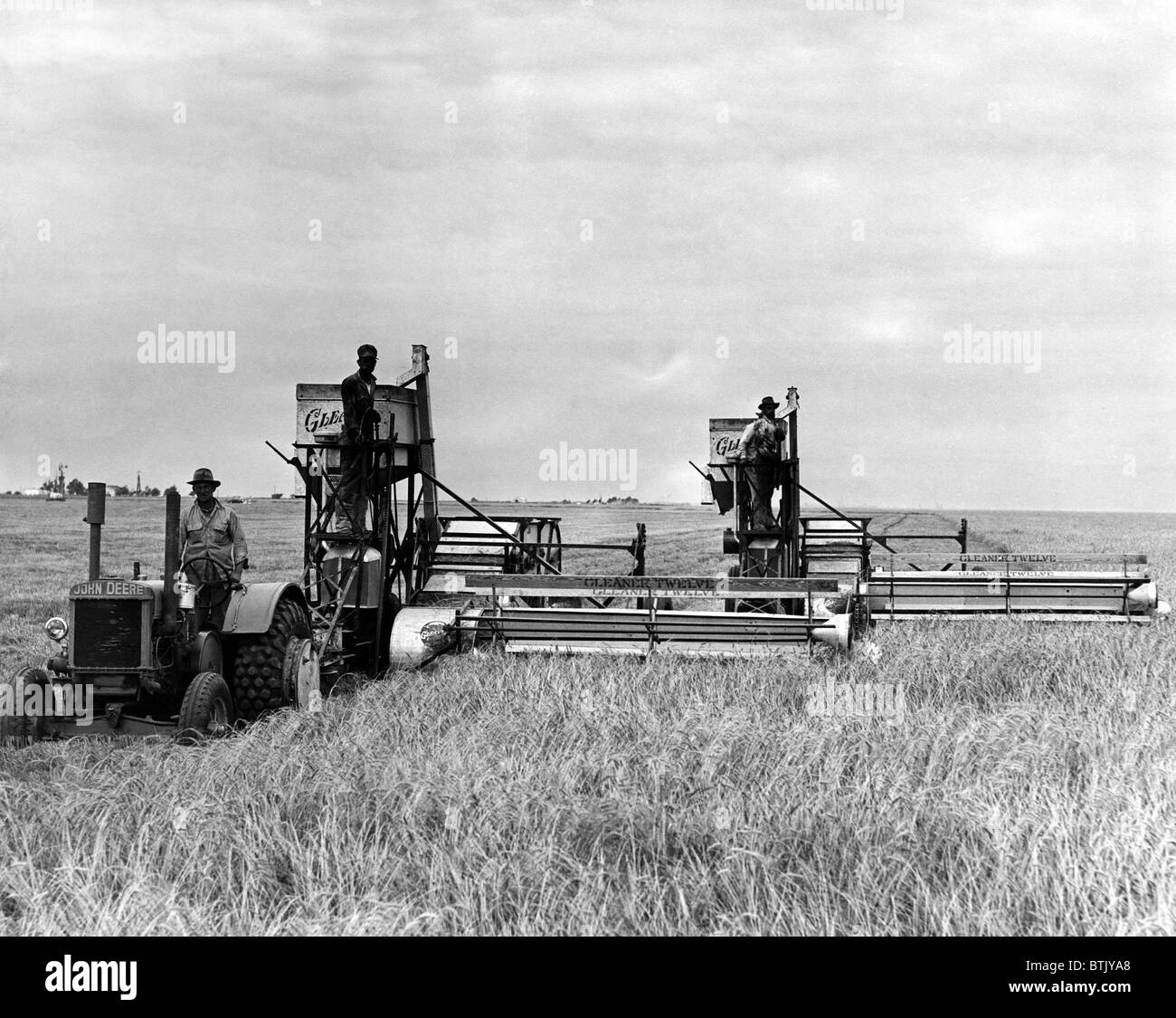A tractor used to pull two combines on a big wheat farm near Spearman ...