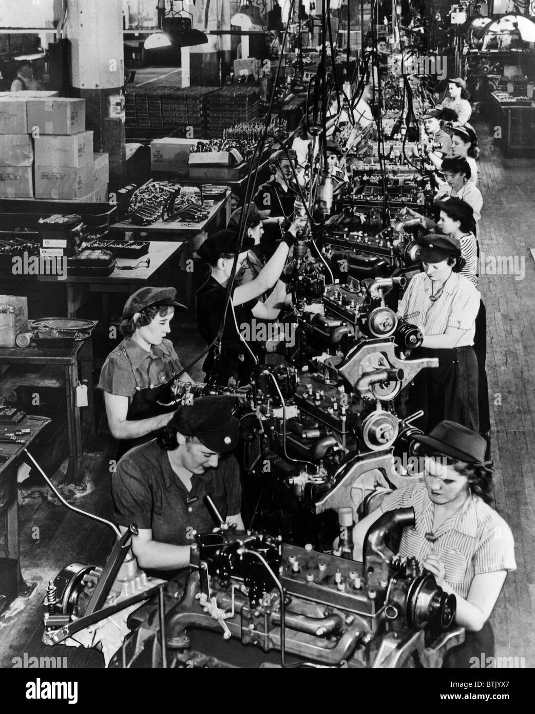 Women work on the assembly line for Dodge military vehicles, 1944 ...
