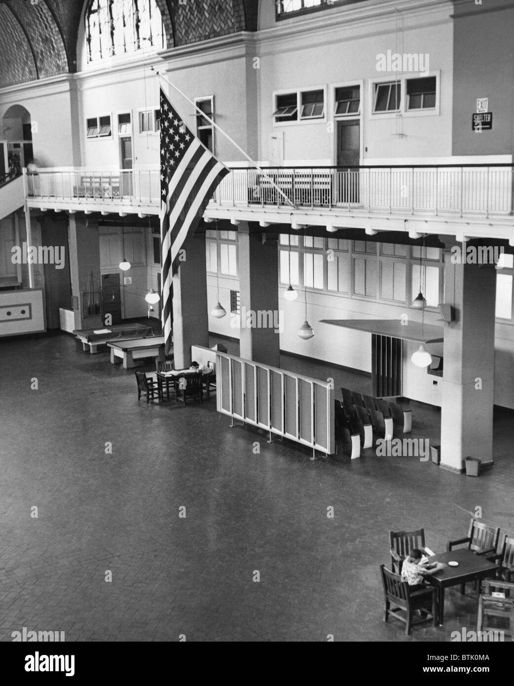 The 'Passenger Room' of the main building on Ellis Island, New York. ca ...