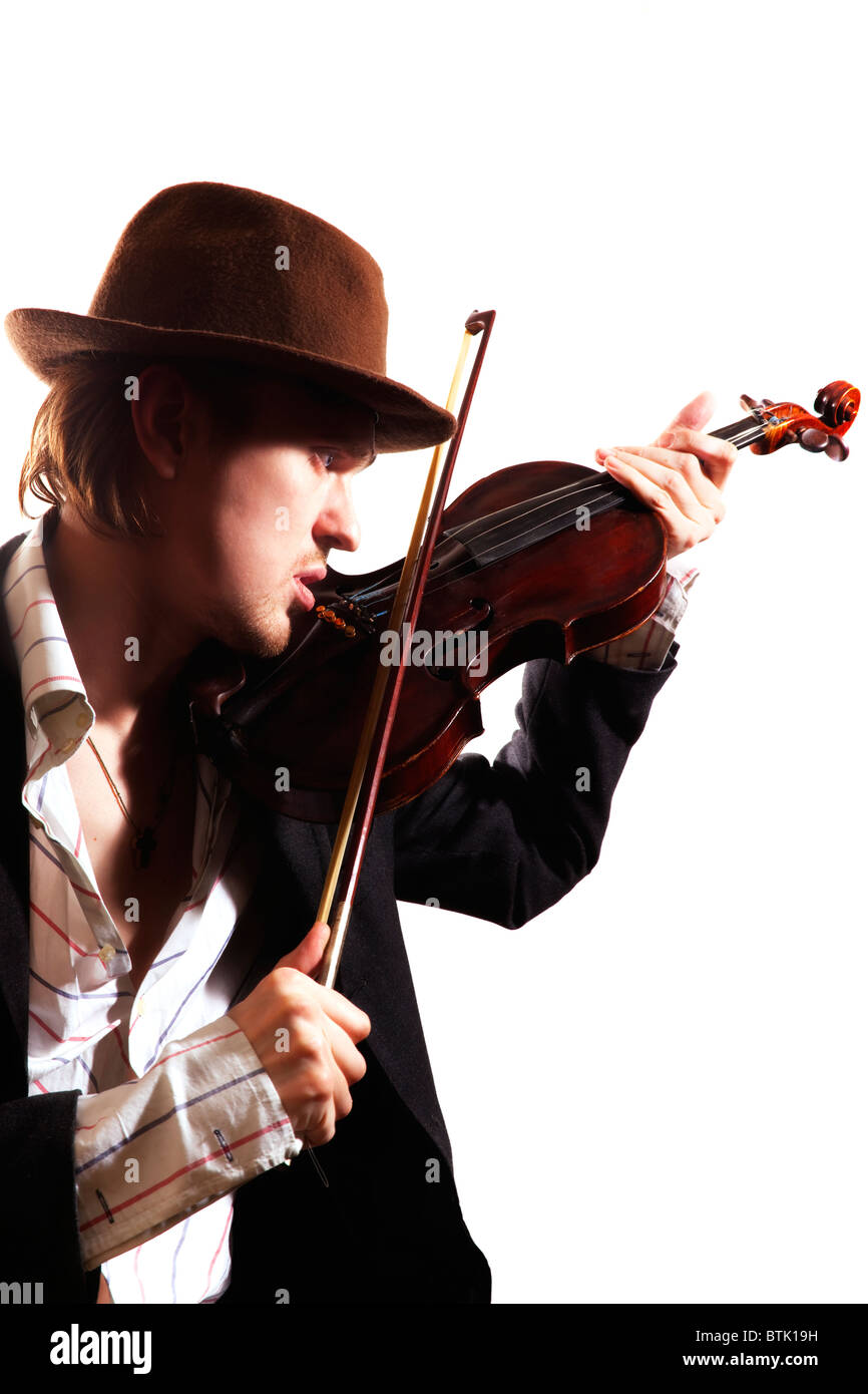 young violinist playing the violin in hat and jacket isolated on white ...
