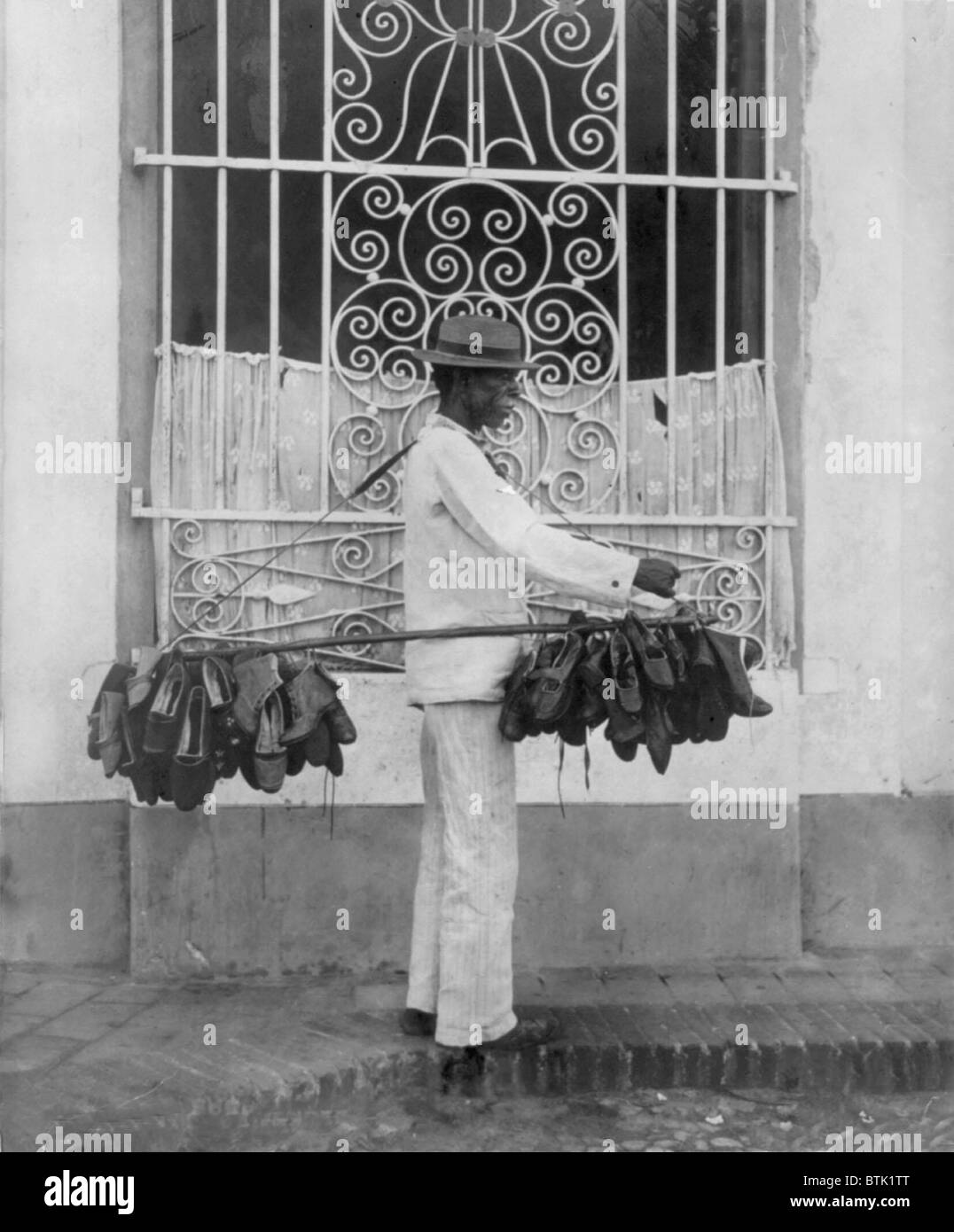 The shoe vendor, photograph circa 1895-1920 Stock Photo - Alamy