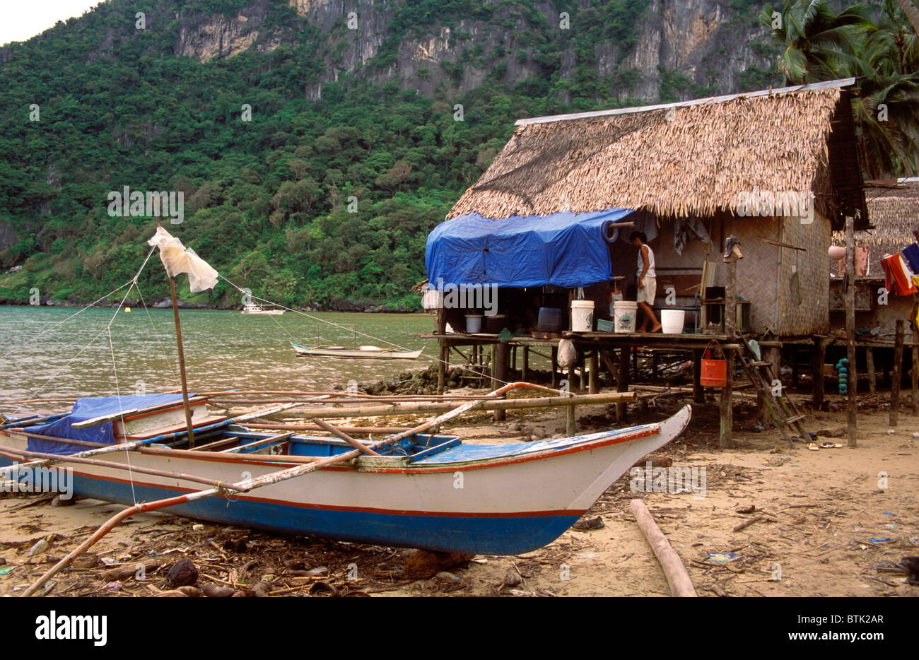 Philippines, Palawan, fishermen's boat, vernacular bamboo hut, and ...