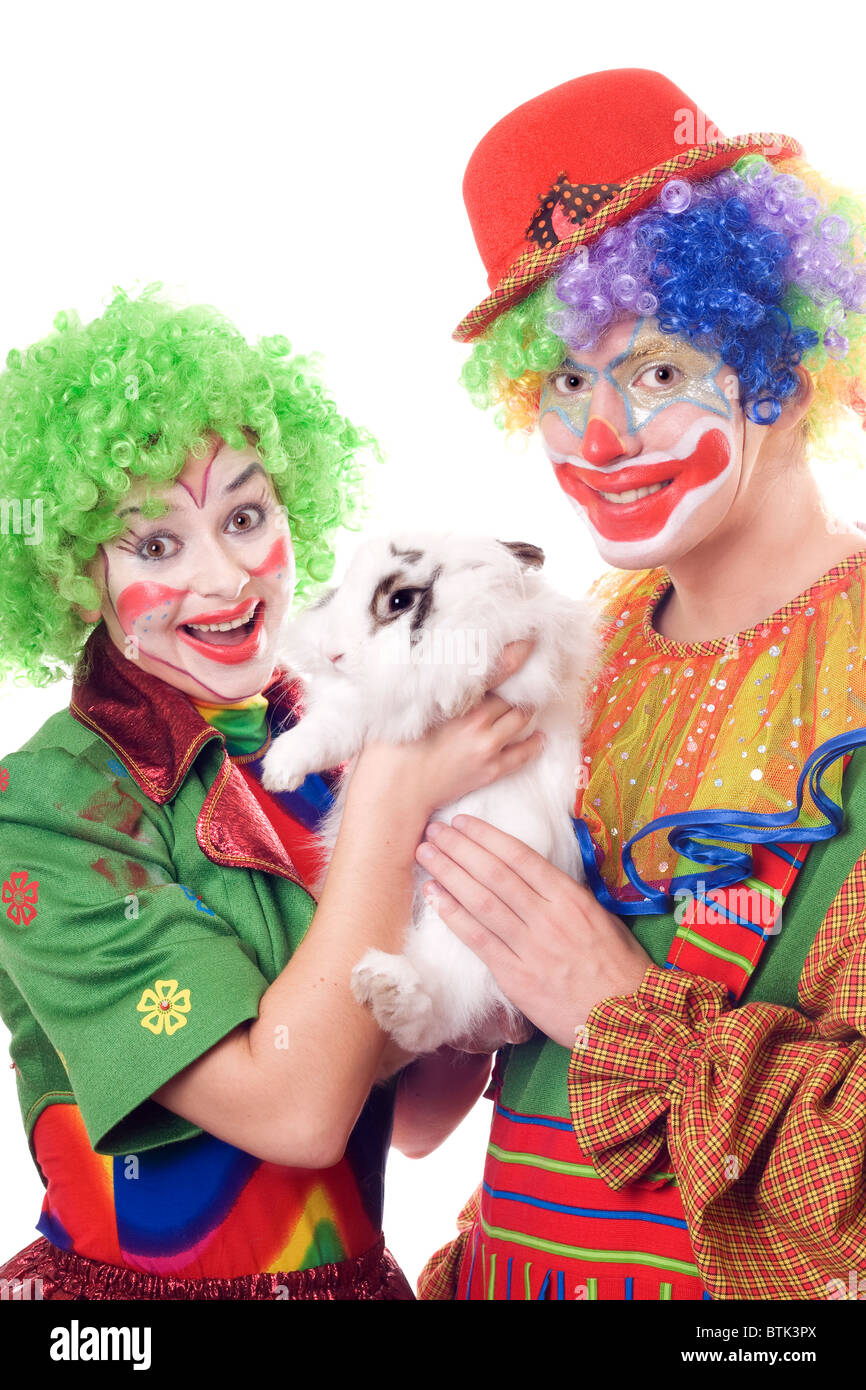 Two joyful clown with a white rabbit. Isolated Stock Photo - Alamy