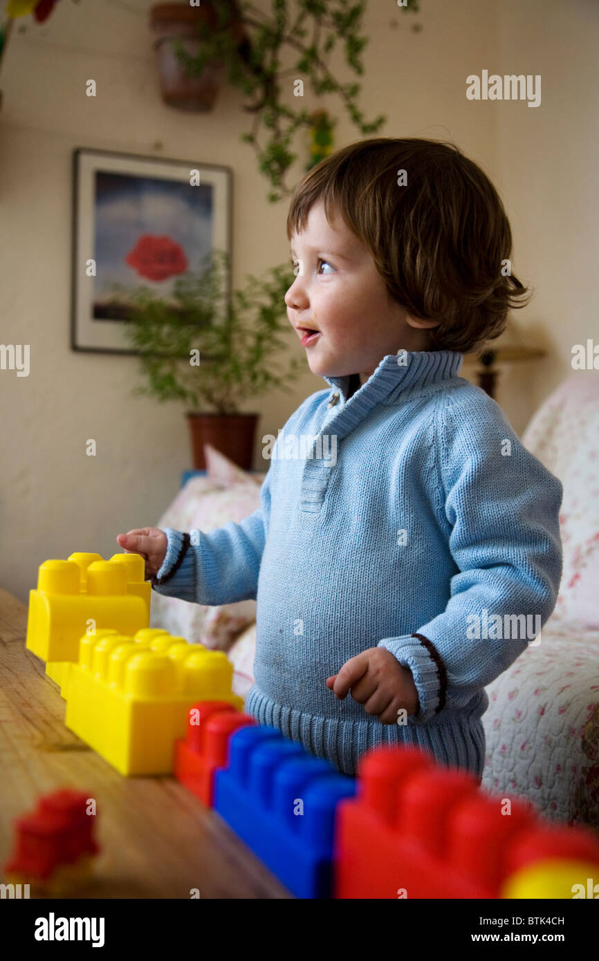 22 month boy playing with color building bricks Stock Photo - Alamy