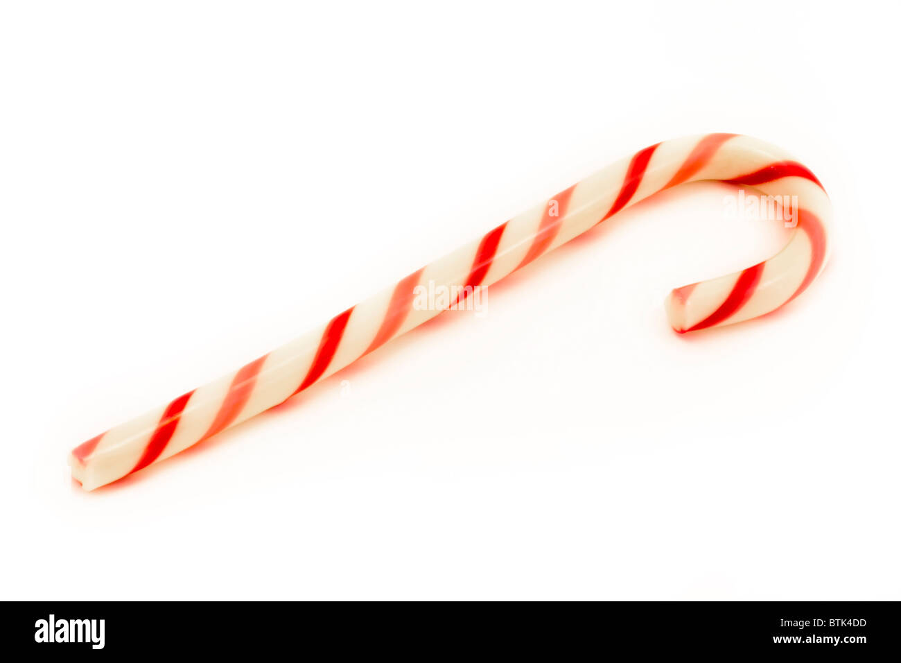 red and pink striped candy cane isolated over white Stock Photo - Alamy
