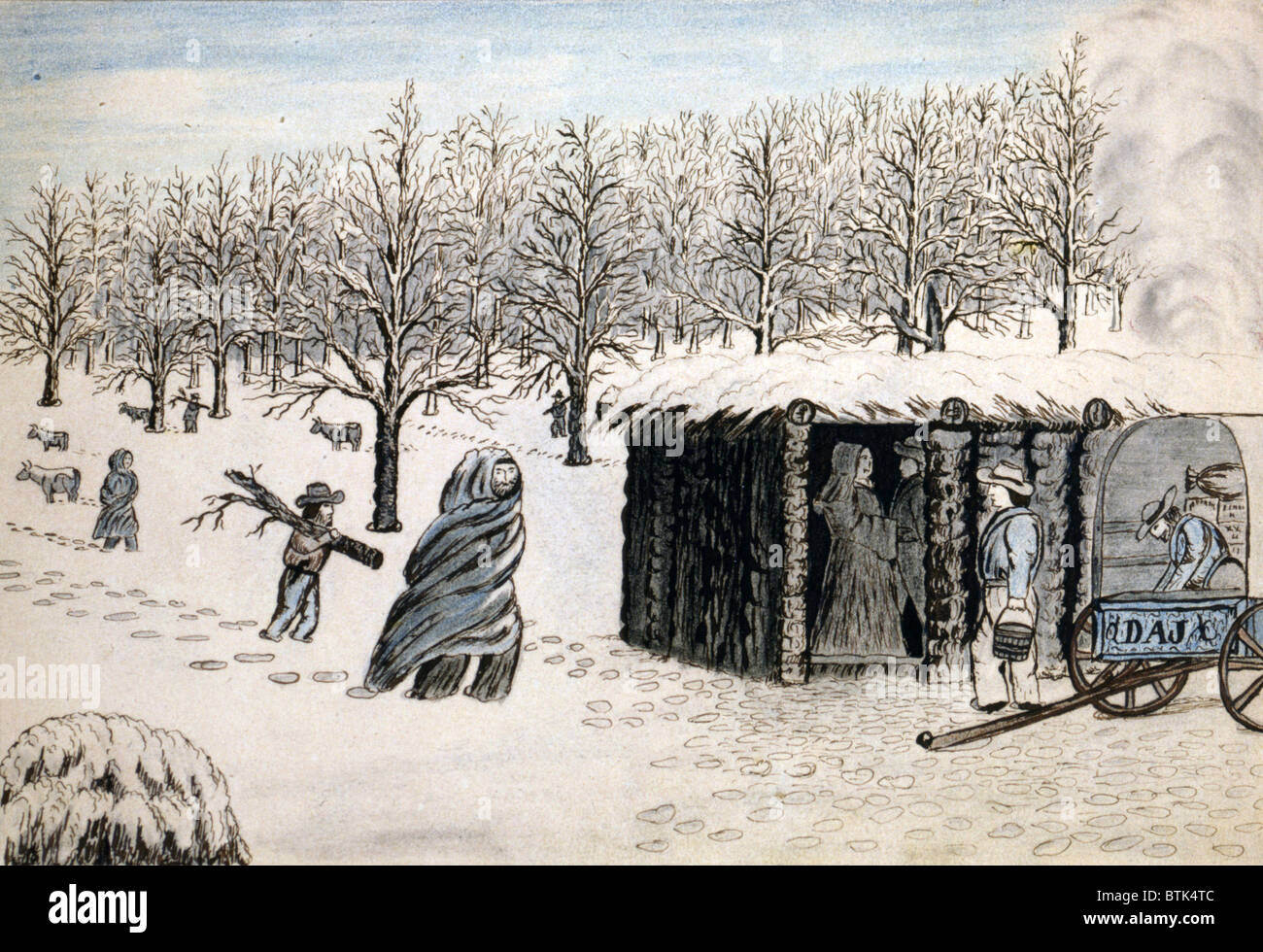 Wagon Train to the West. A wagon train of settlers camped in the snow ...