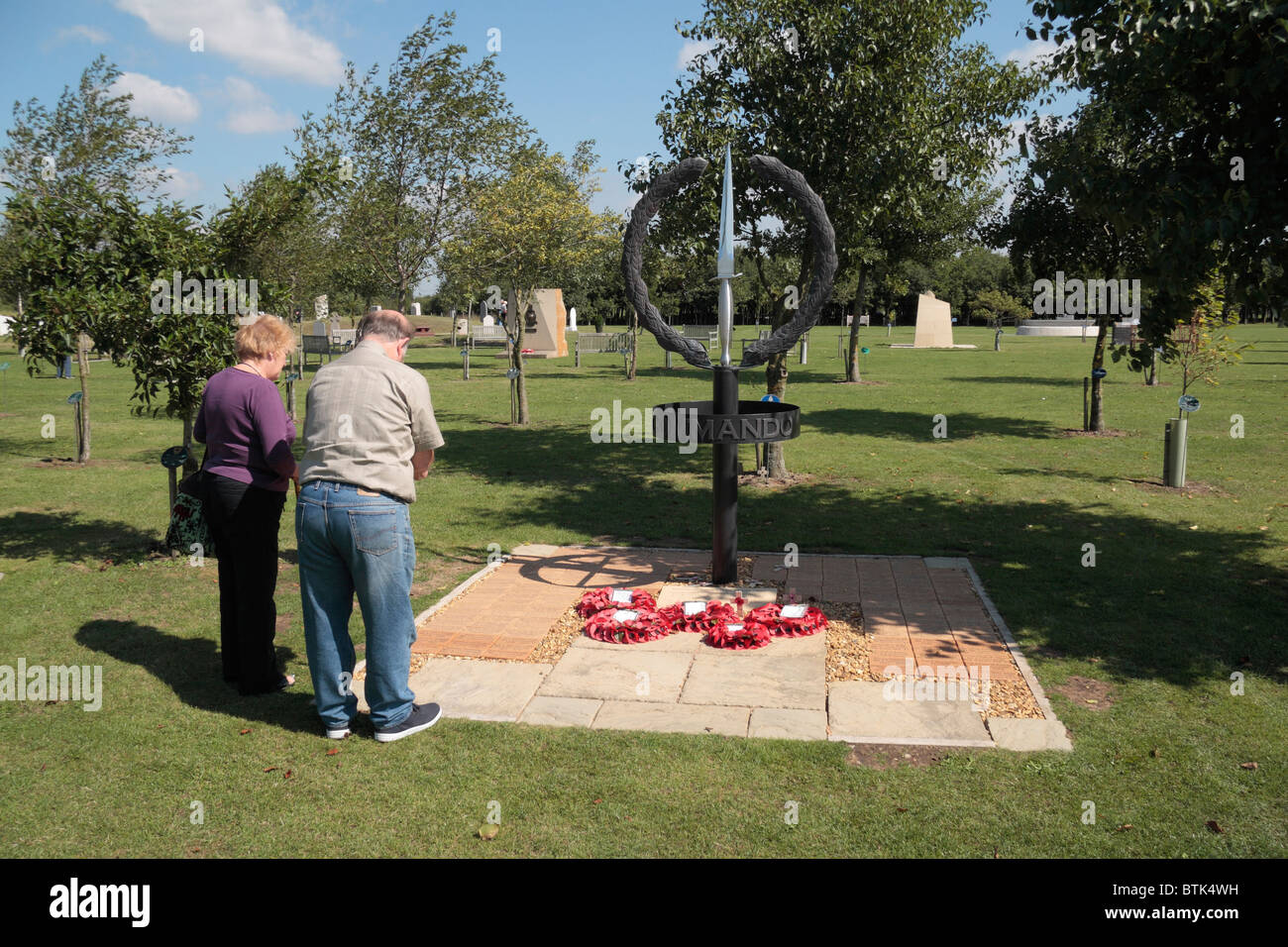 Visitors to the National Memorial Arboretum, Alrewas, UK, in front of ...