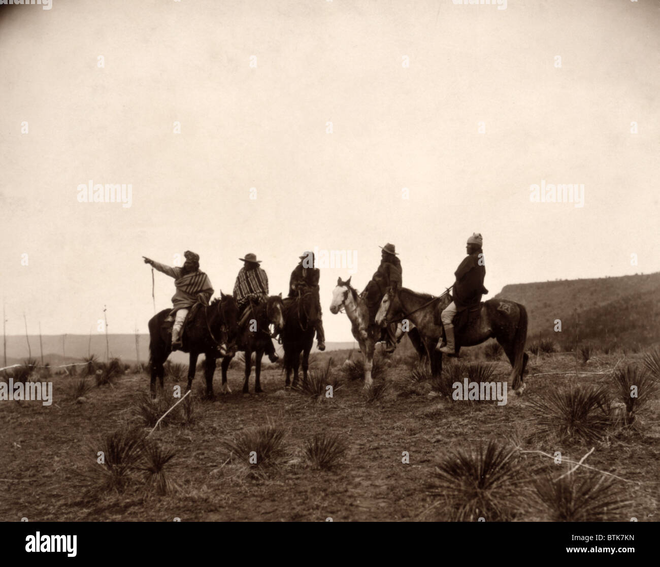 Apaches. The lost trail- Five Apache on horseback in the desert. photo ...