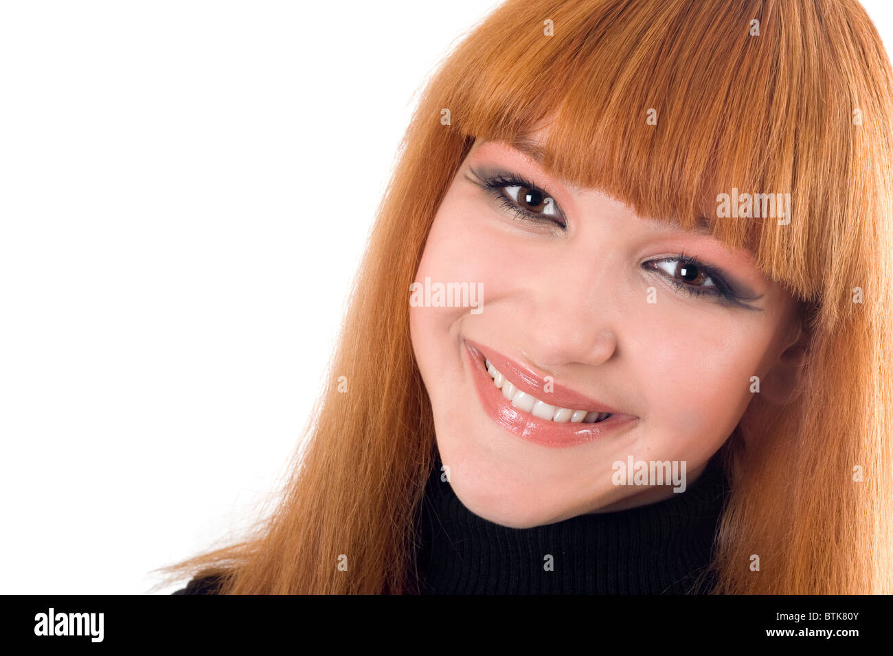 Portrait of the attractive smiling redheaded woman Stock Photo - Alamy
